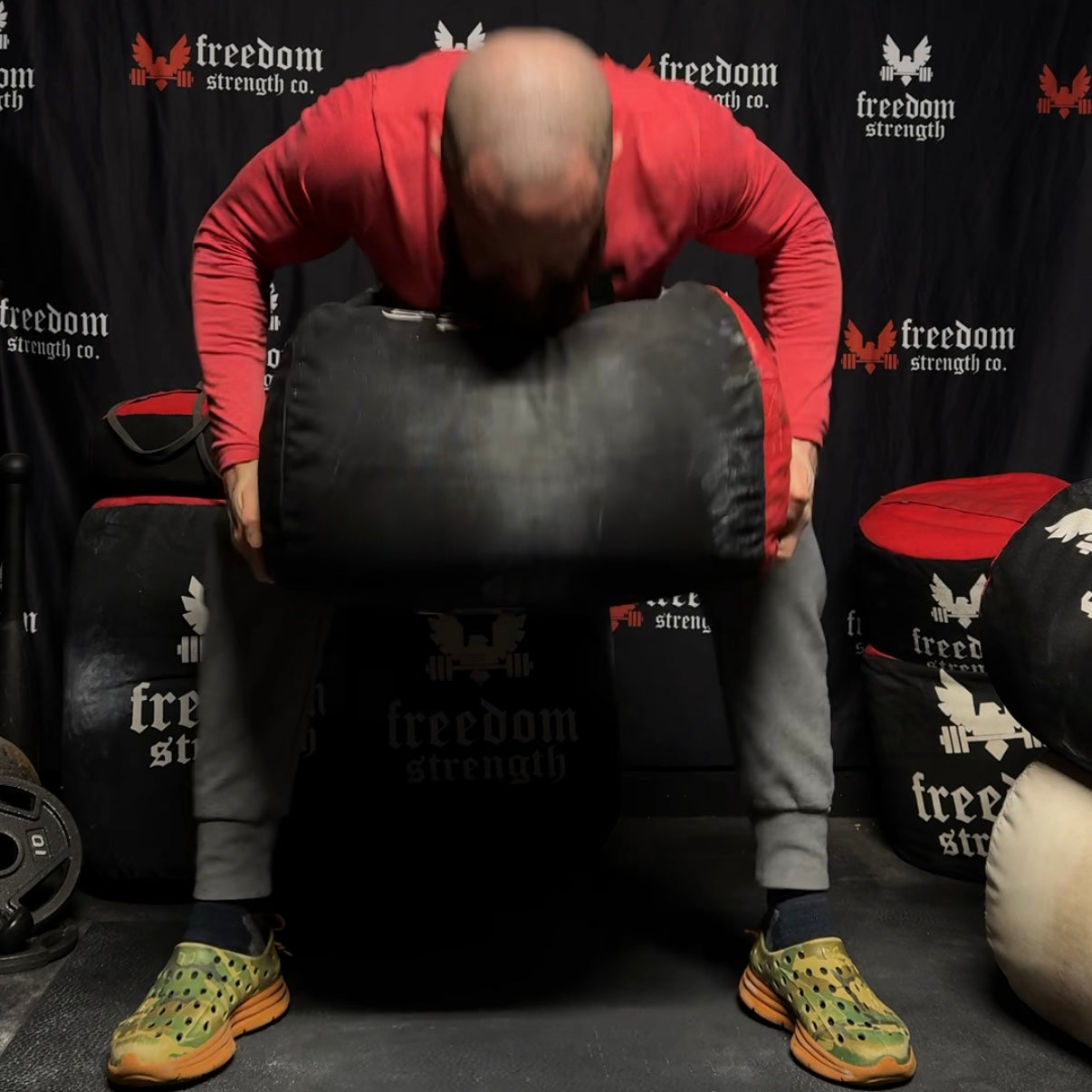 The Benefits of Doing Bent-Over Rows with a Strongman Sandbag – Freedom ...